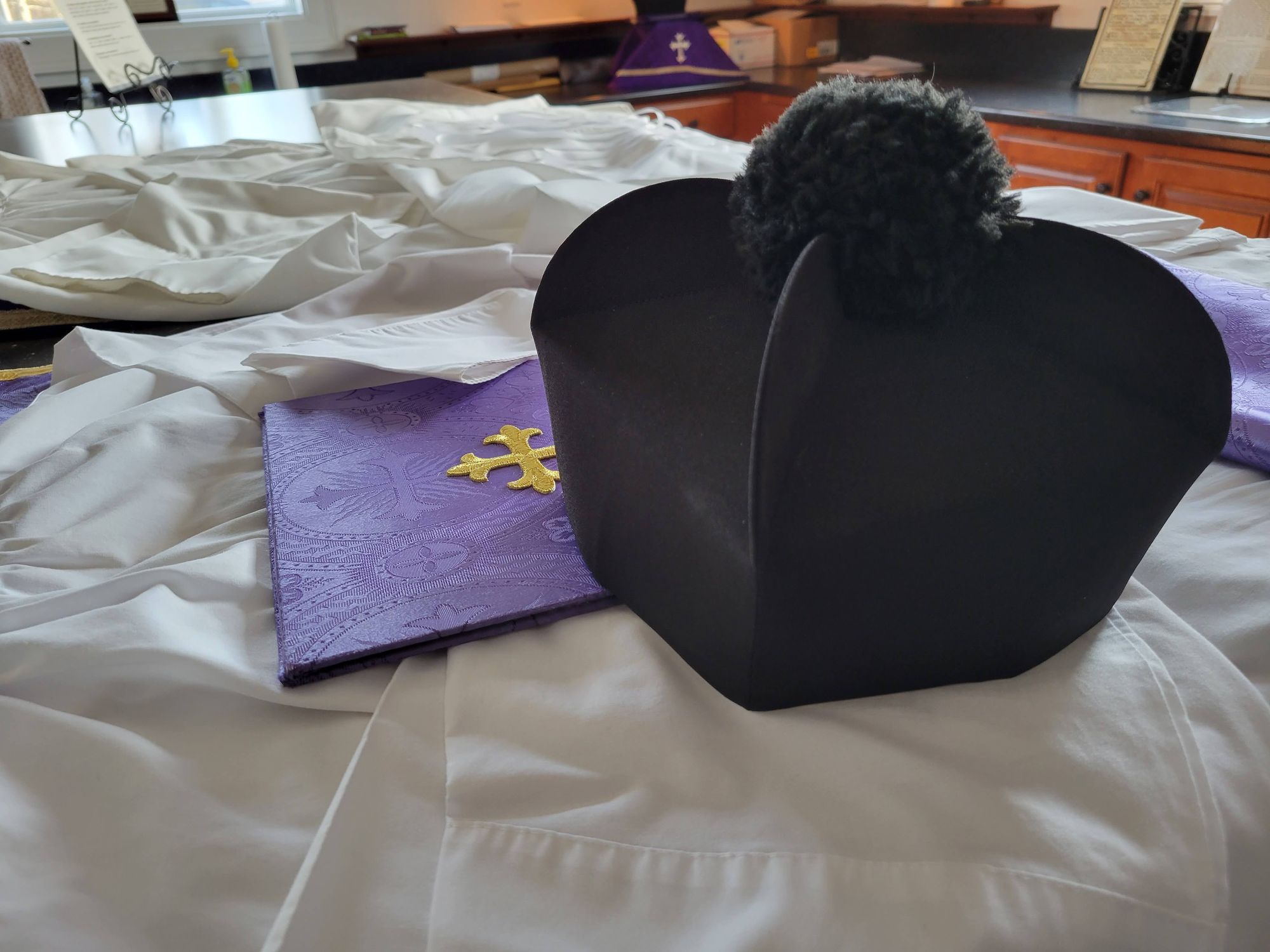 Alb, Stole, and Biretta (Latin Rite) - Catholic Stock Photo