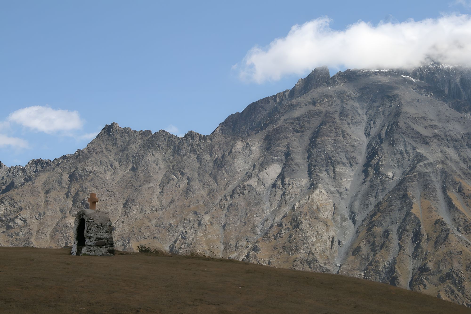 Shrine near the Gergeti Trinity Church, Georgia - Catholic Stock Photo