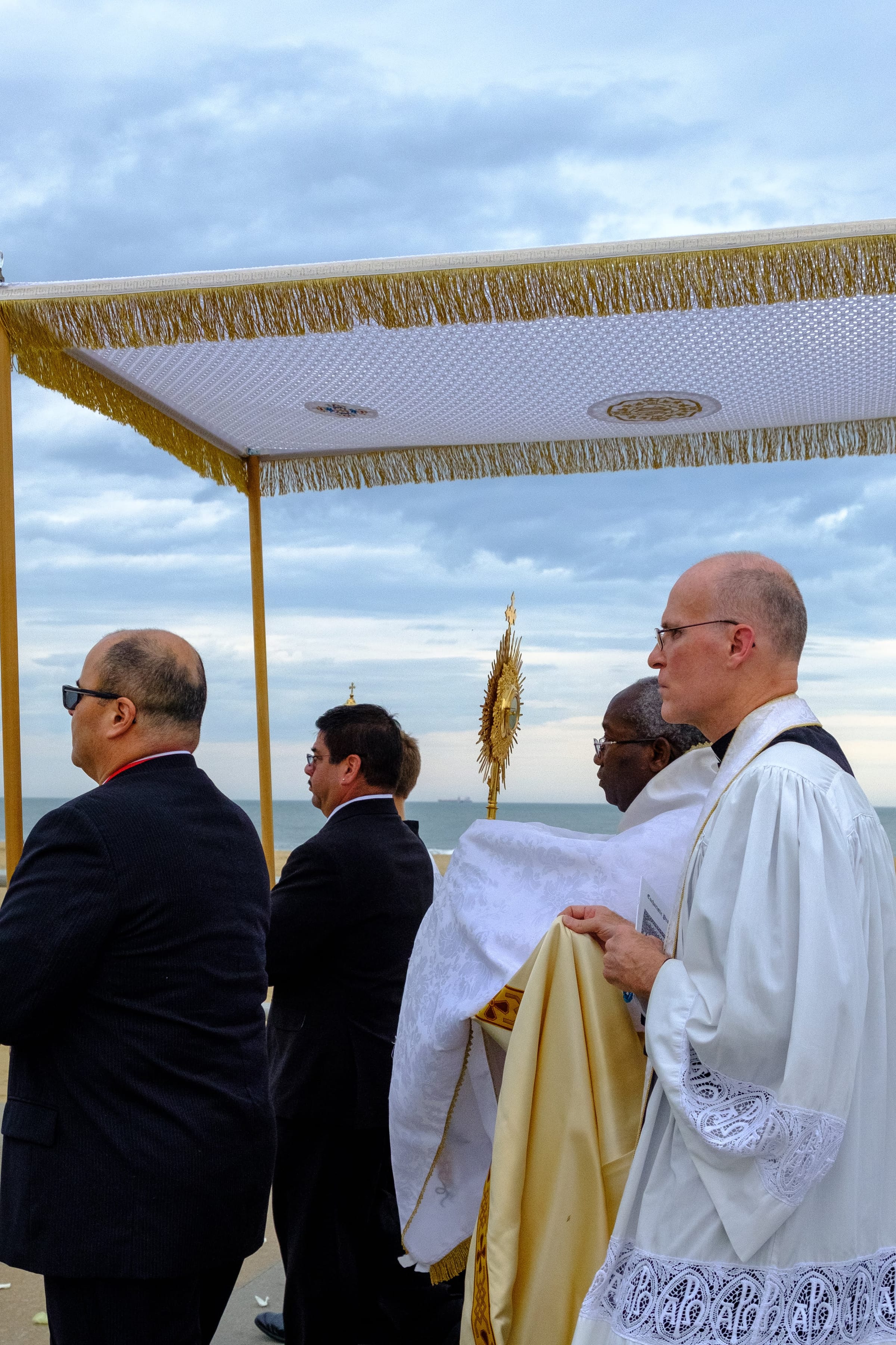 Priest Holding Monstrance at Eucharistic Procession - Catholic Stock Photo